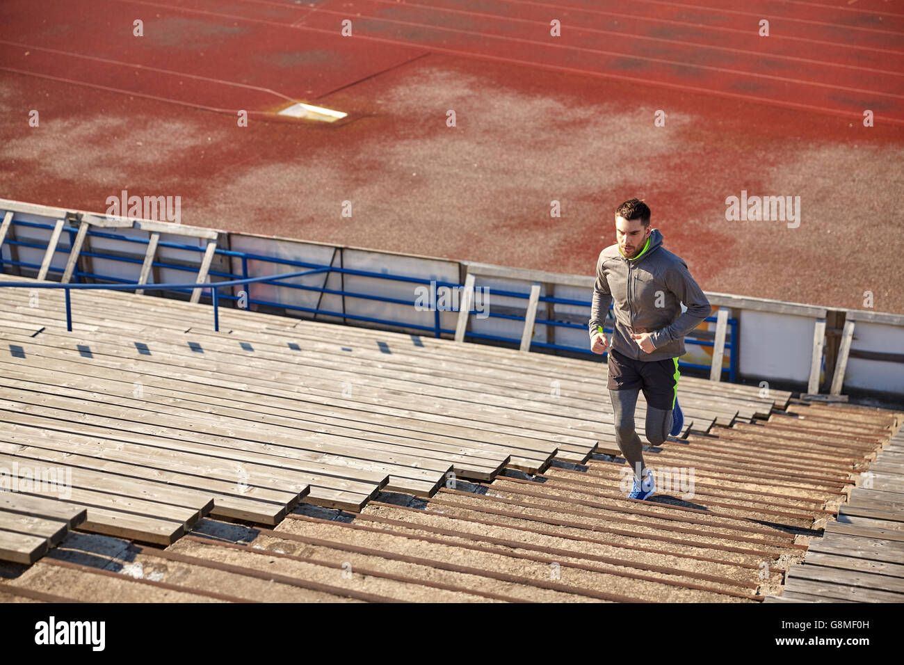 Happy young man running upstairs hi-res stock photography and images ...