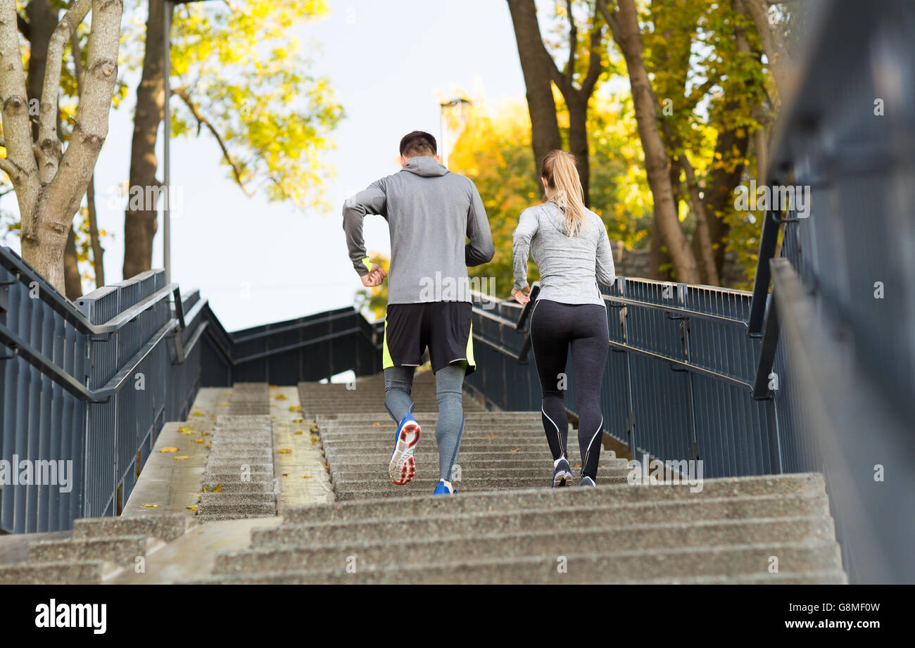 Young woman jogging upstairs in hi-res stock photography and images - Alamy