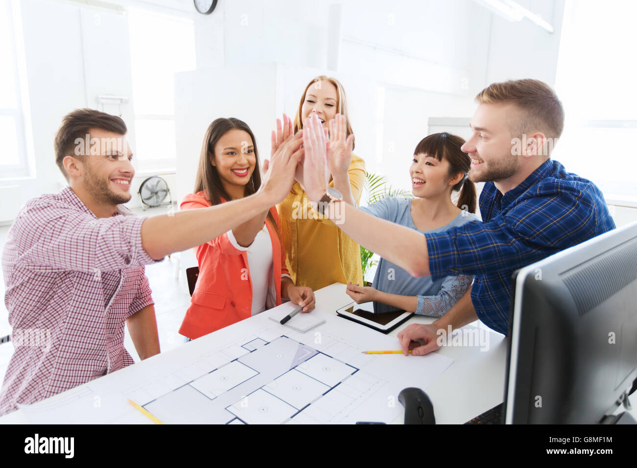 creative team making high five at office Stock Photo - Alamy
