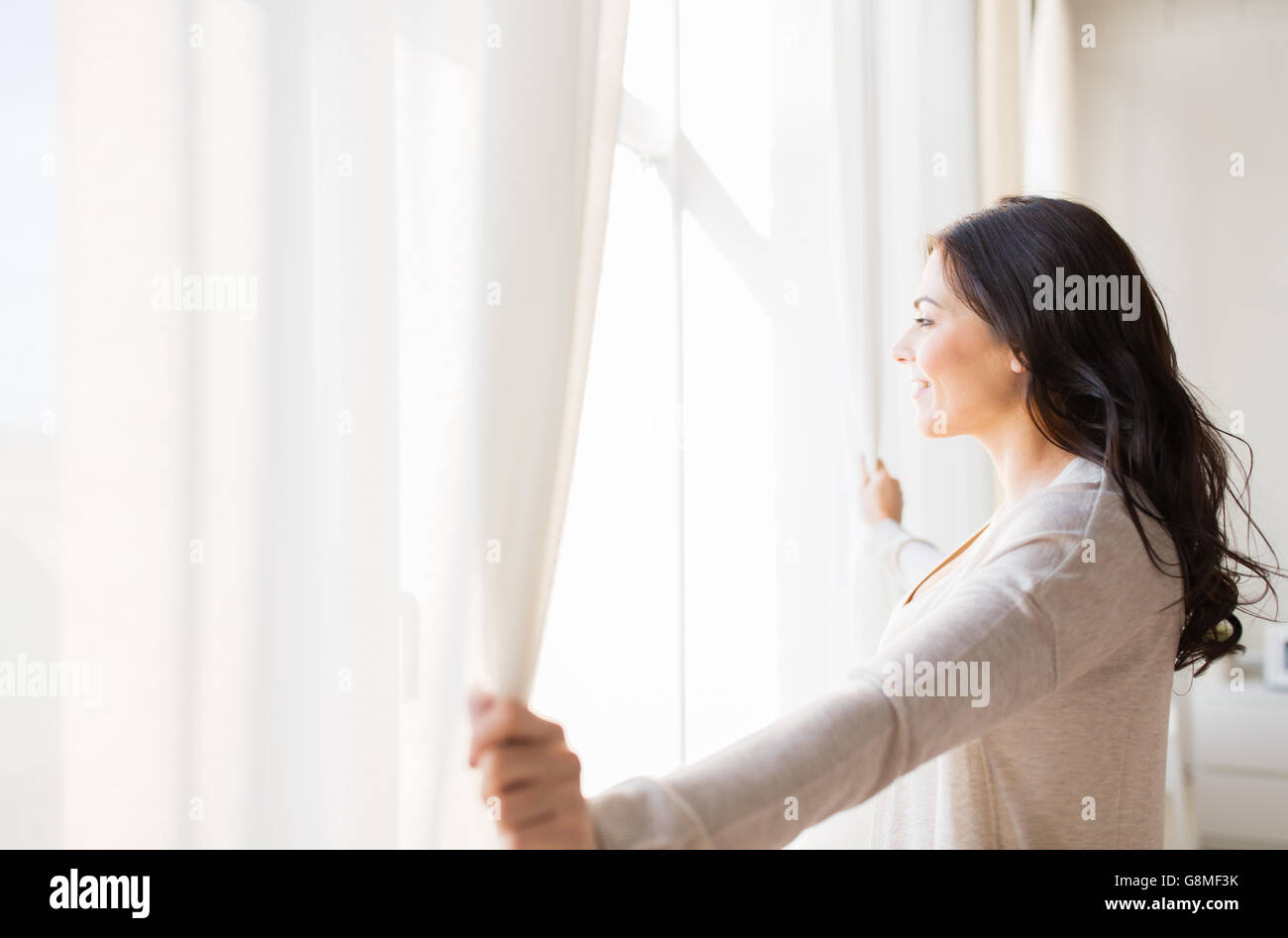 Woman Opening Curtains Stock Photos & Woman Opening Curtains Stock ...
