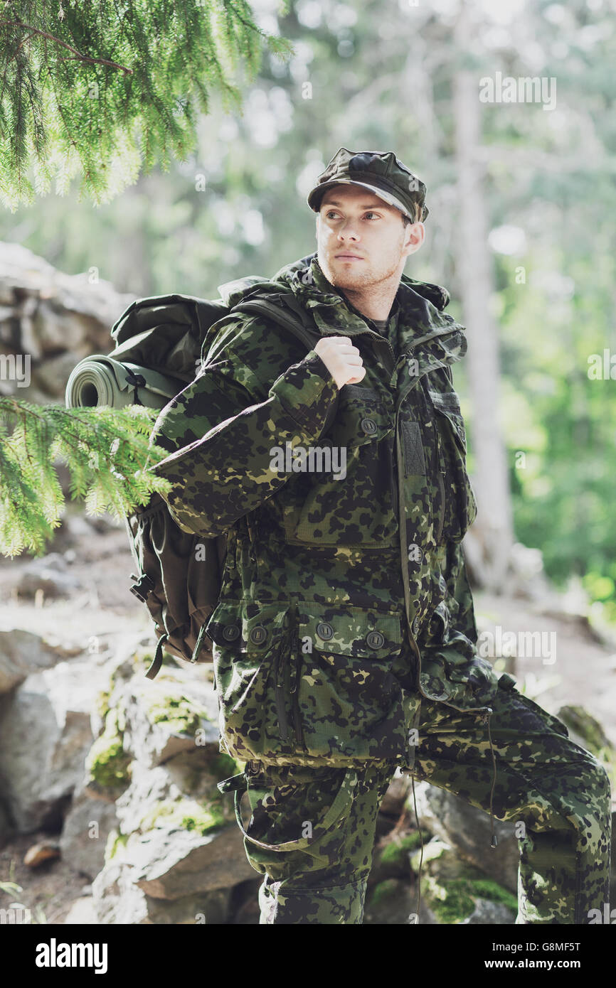 young soldier with backpack in forest Stock Photo - Alamy