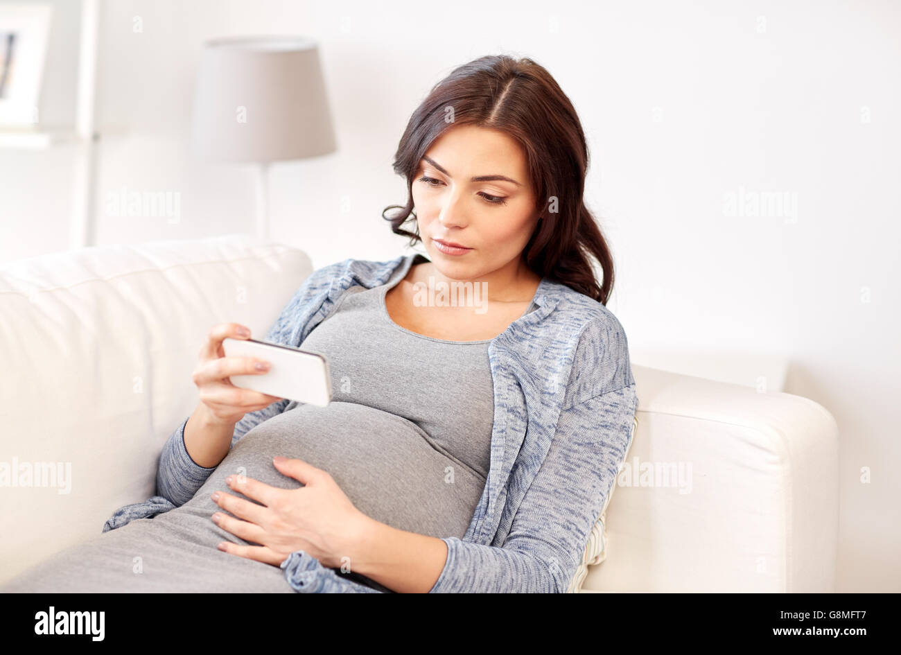 Sad pregnant woman hi-res stock photography and images - Alamy