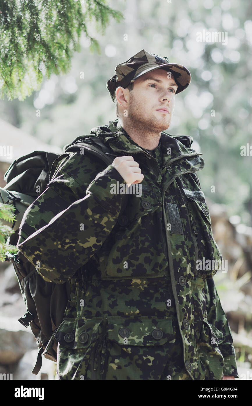 young soldier with backpack in forest Stock Photo - Alamy