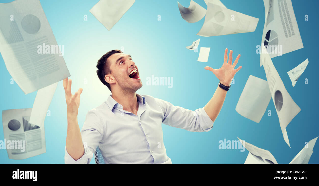Angry man throwing papers table hi-res stock photography and images - Alamy