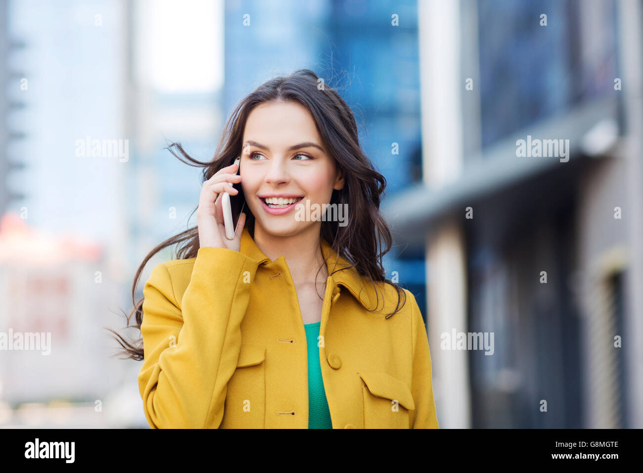 smiling young woman or girl calling on smartphone Stock Photo - Alamy