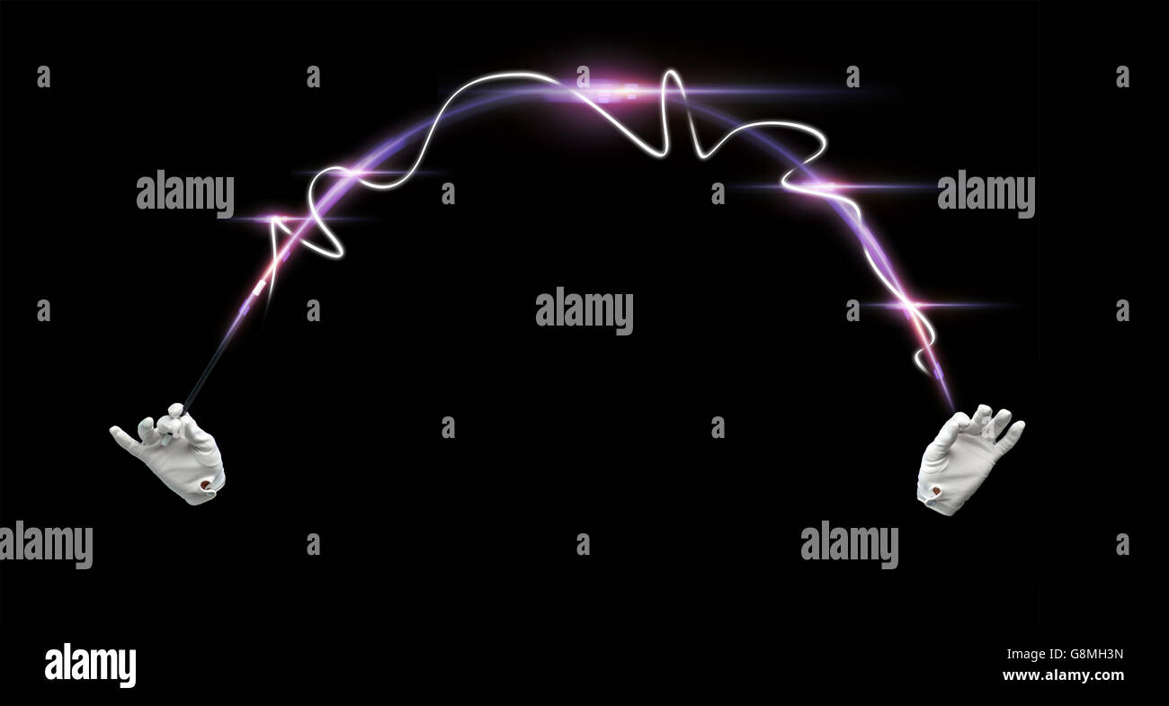 magician hands with magic wand showing trick Stock Photo - Alamy