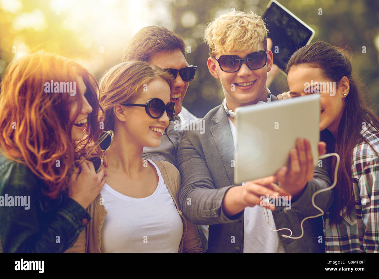students or teenagers with tablet pc taking selfie Stock Photo - Alamy