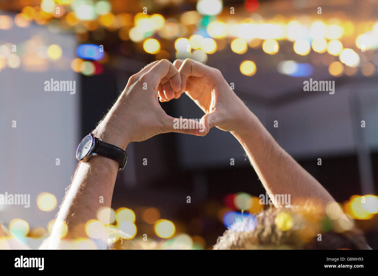 Group of people showing the heart shape hi-res stock photography and ...