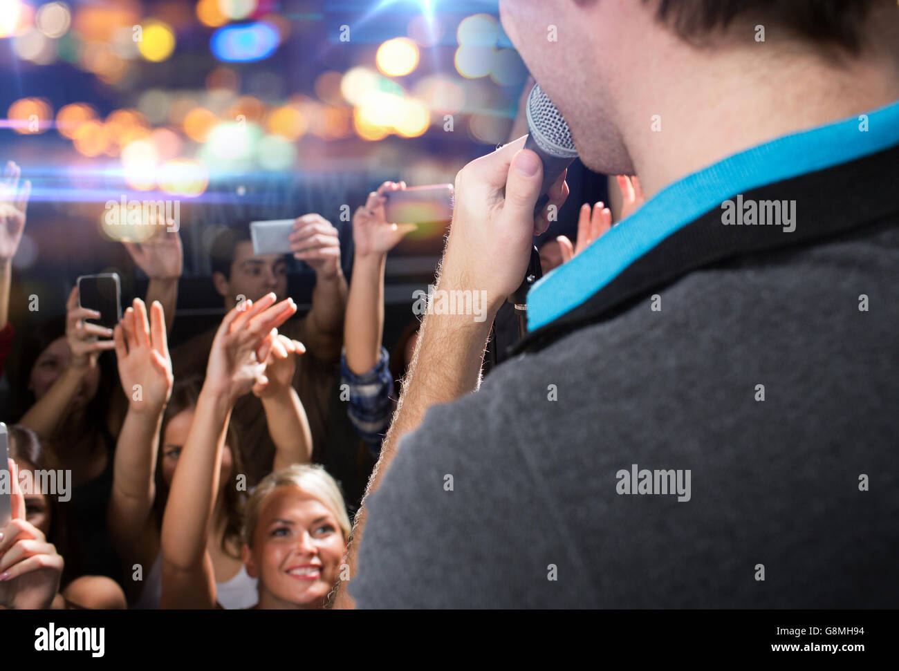 Happy singing crowd hi-res stock photography and images - Alamy
