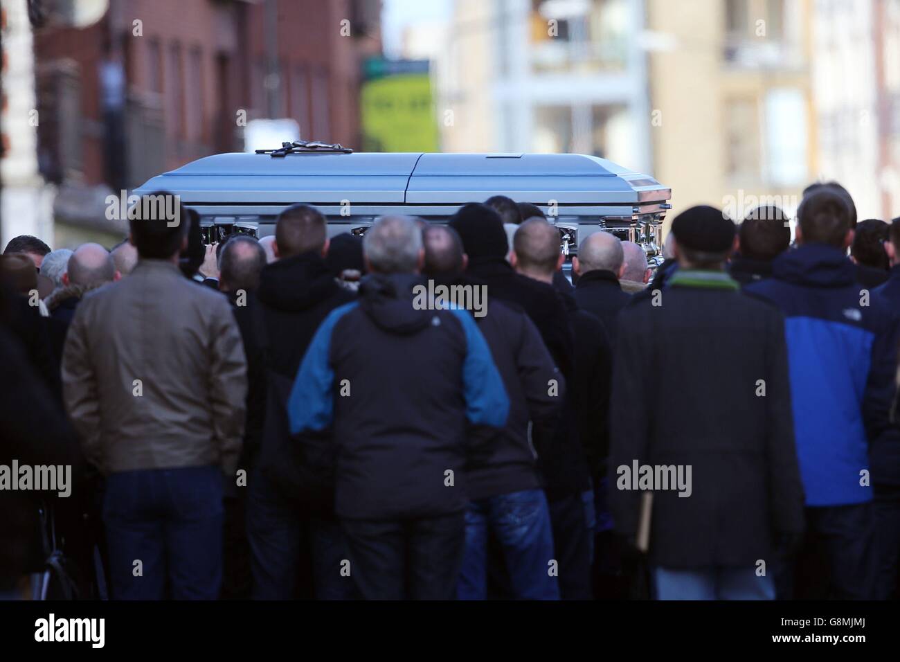 The coffin is carried into St Nicholas of Myra church on Francis Street ...