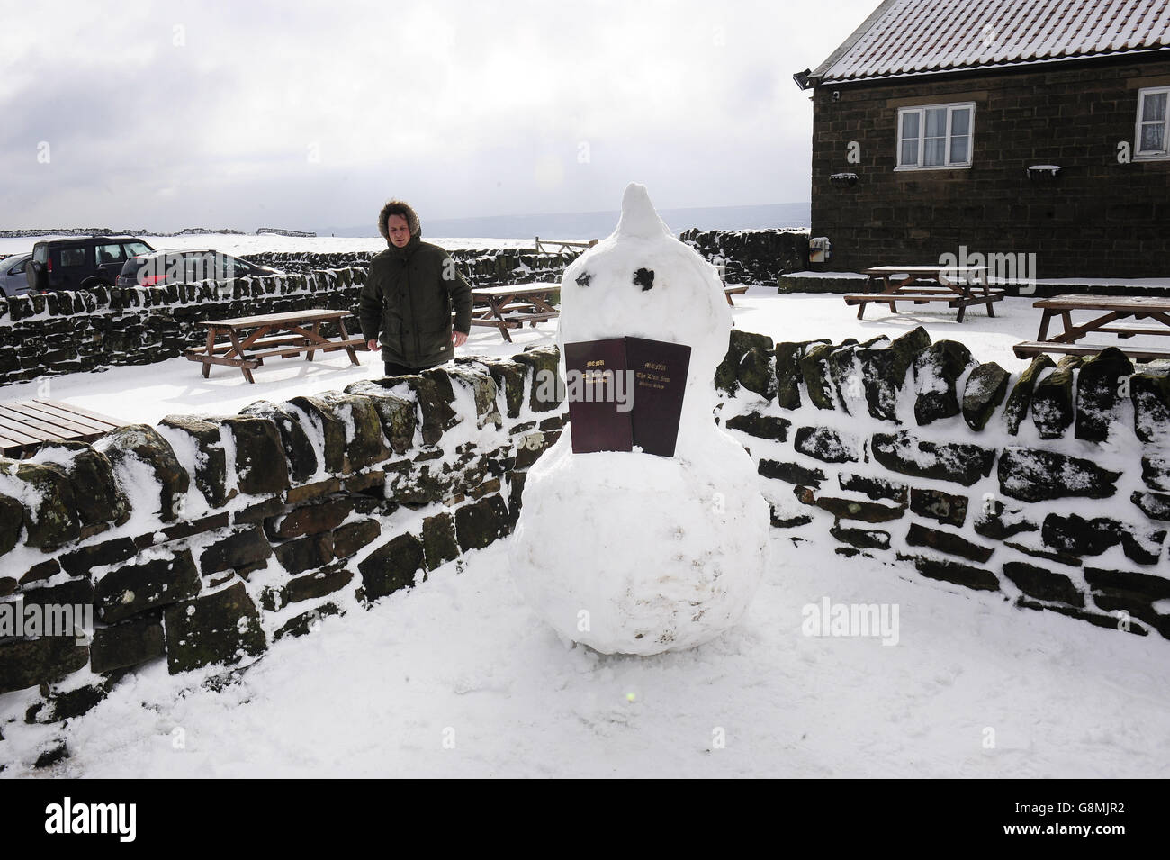 A member of staff at the Lion Inn at Blakey Ridge on the North York ...