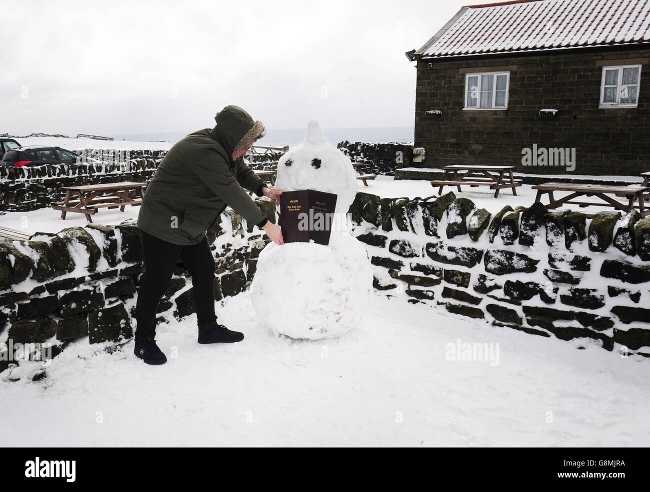 A member of staff at the Lion Inn at Blakey Ridge on the North York ...