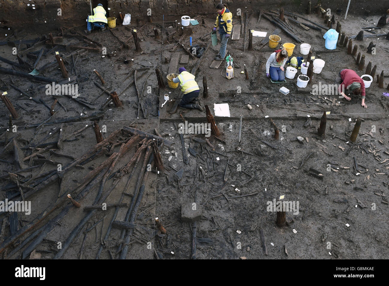Archaeologists work on the Must Farm site near Peterborough in ...