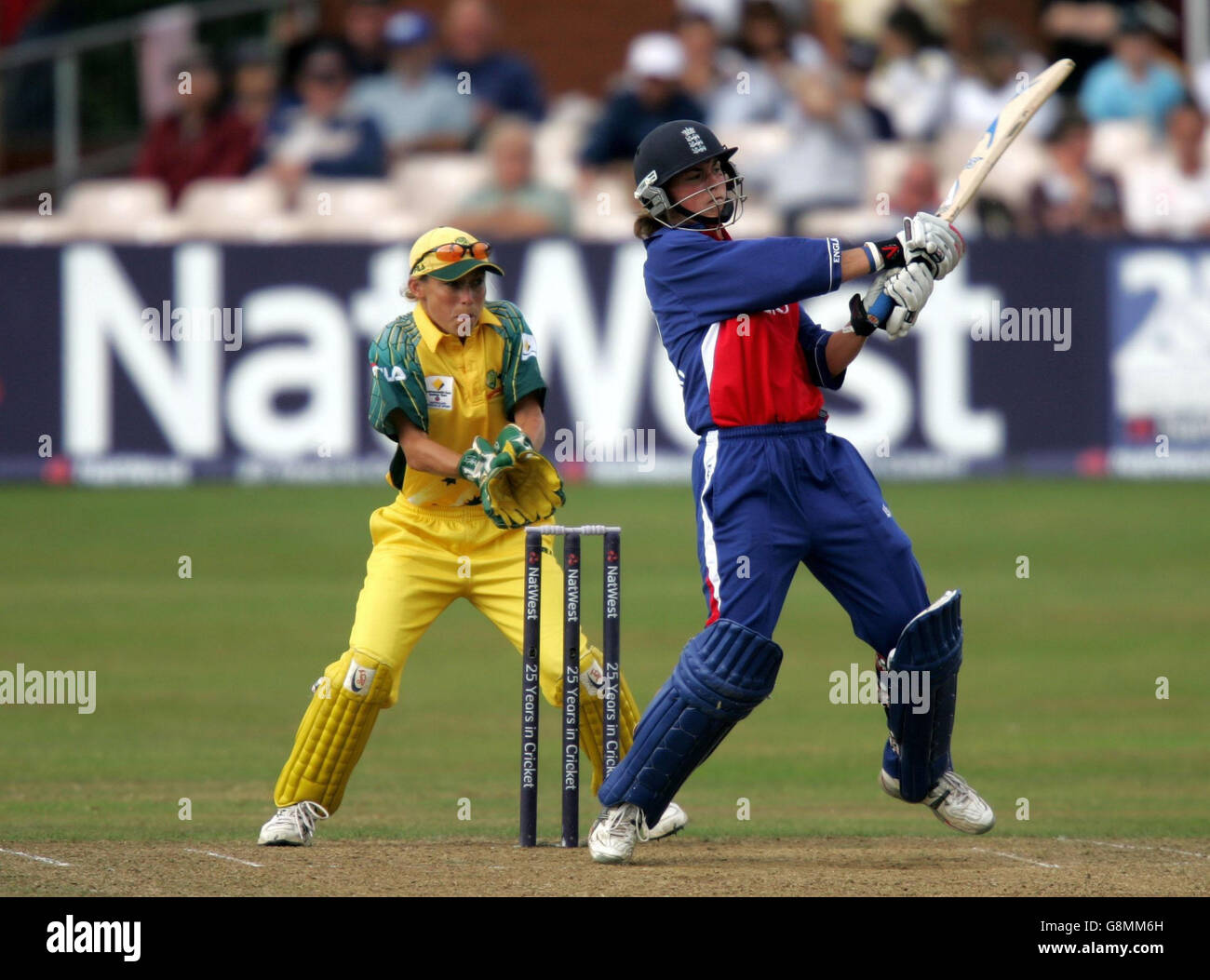 England's Laura Newton (R) hits a boundary in her innings of 61 during ...