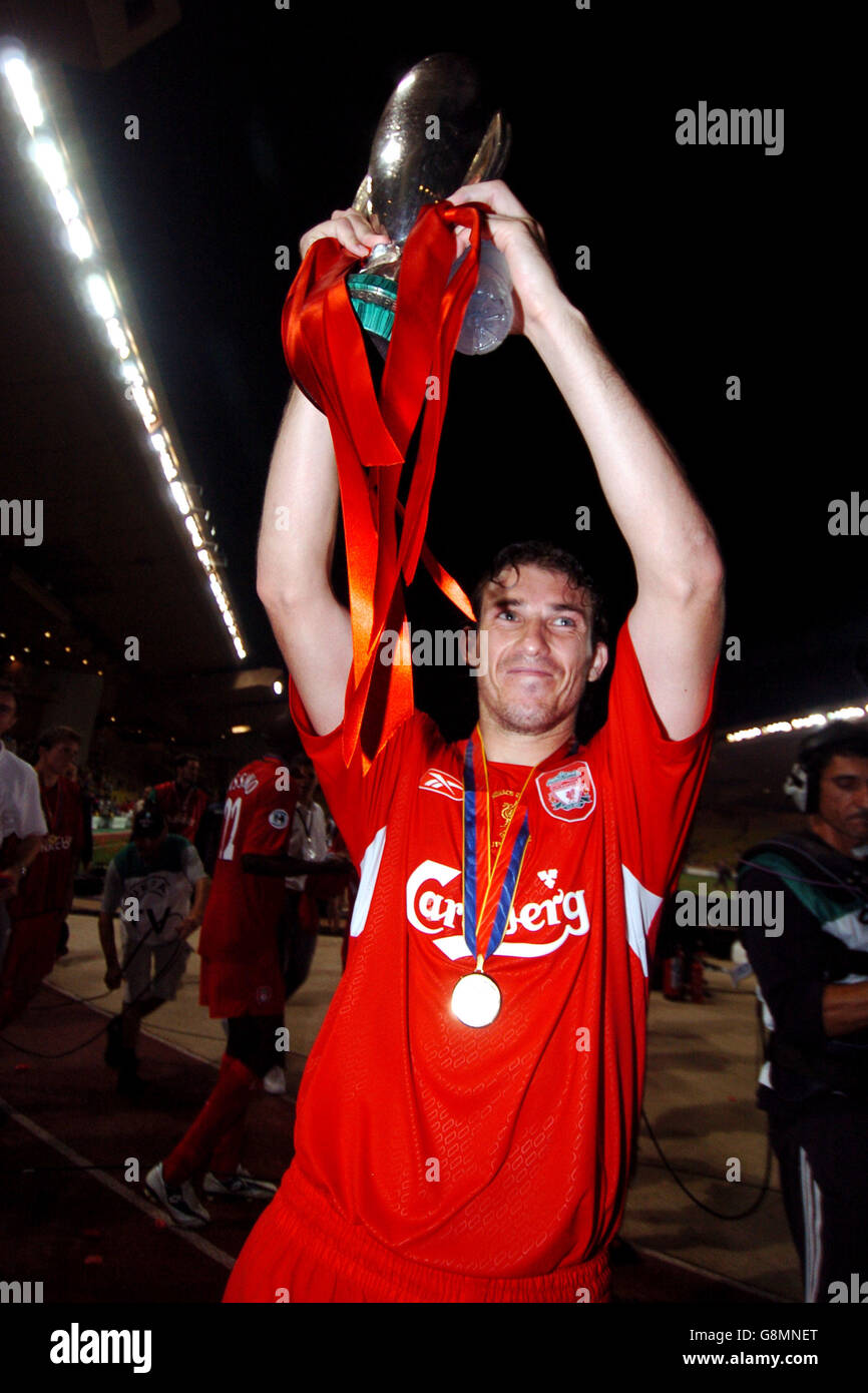 Liverpools josemi celebrates with the super cup trophy hi-res stock ...