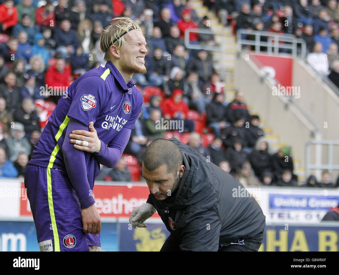 Charlton athletics simon makienok receives treatment for an injury hi ...