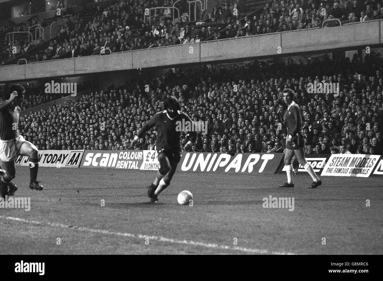 George Best (centre) in action during the Peter Osgood Testimonial ...
