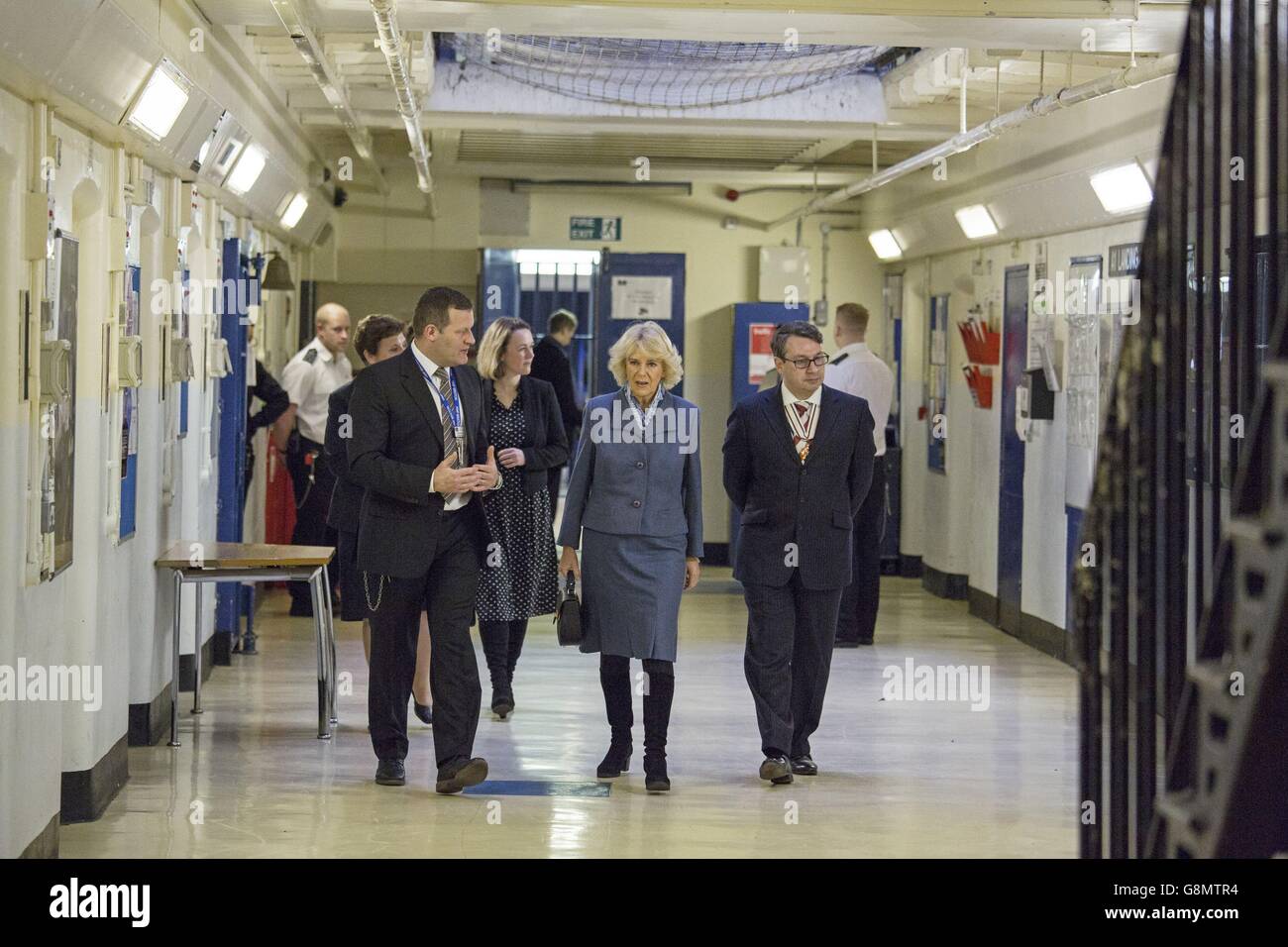 The Duchess of Cornwall walks with Governor Giles Mason (left) and ...