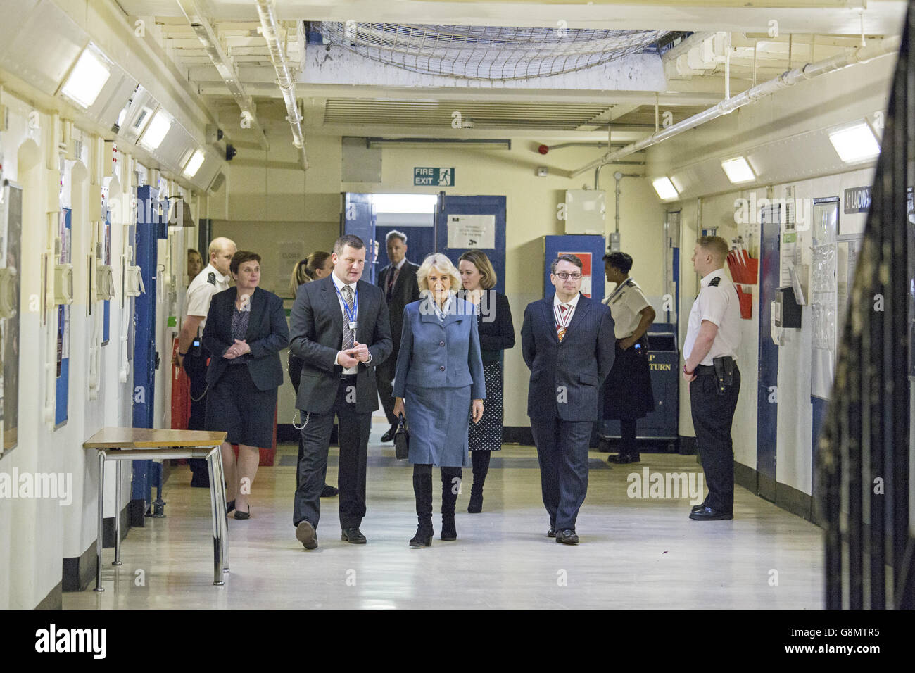 The Duchess of Cornwall walks with Governor Giles Mason (left) and ...