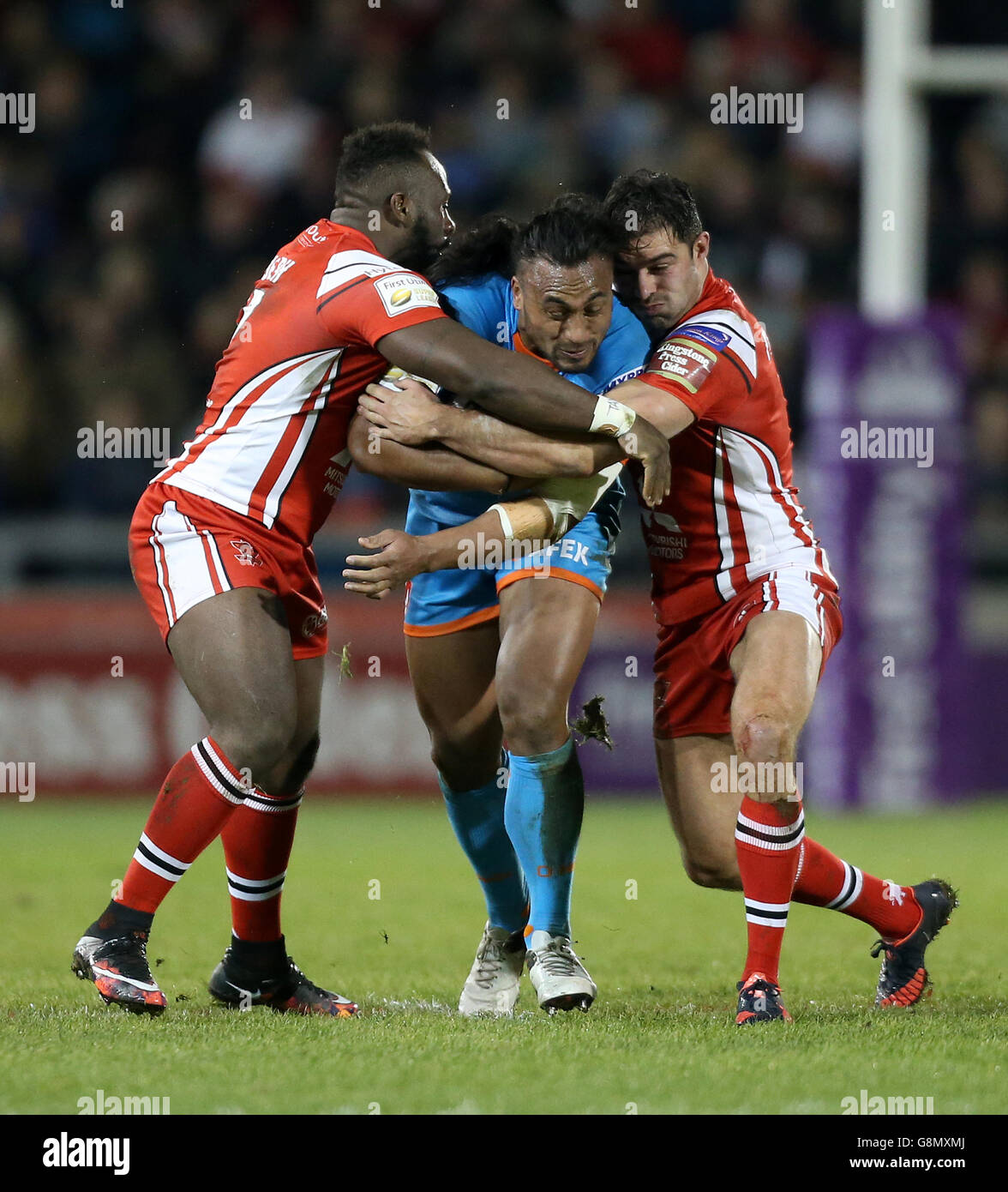 Salford Red Devils' Phil Joseph (left) and Mark Flanagan tackle St ...