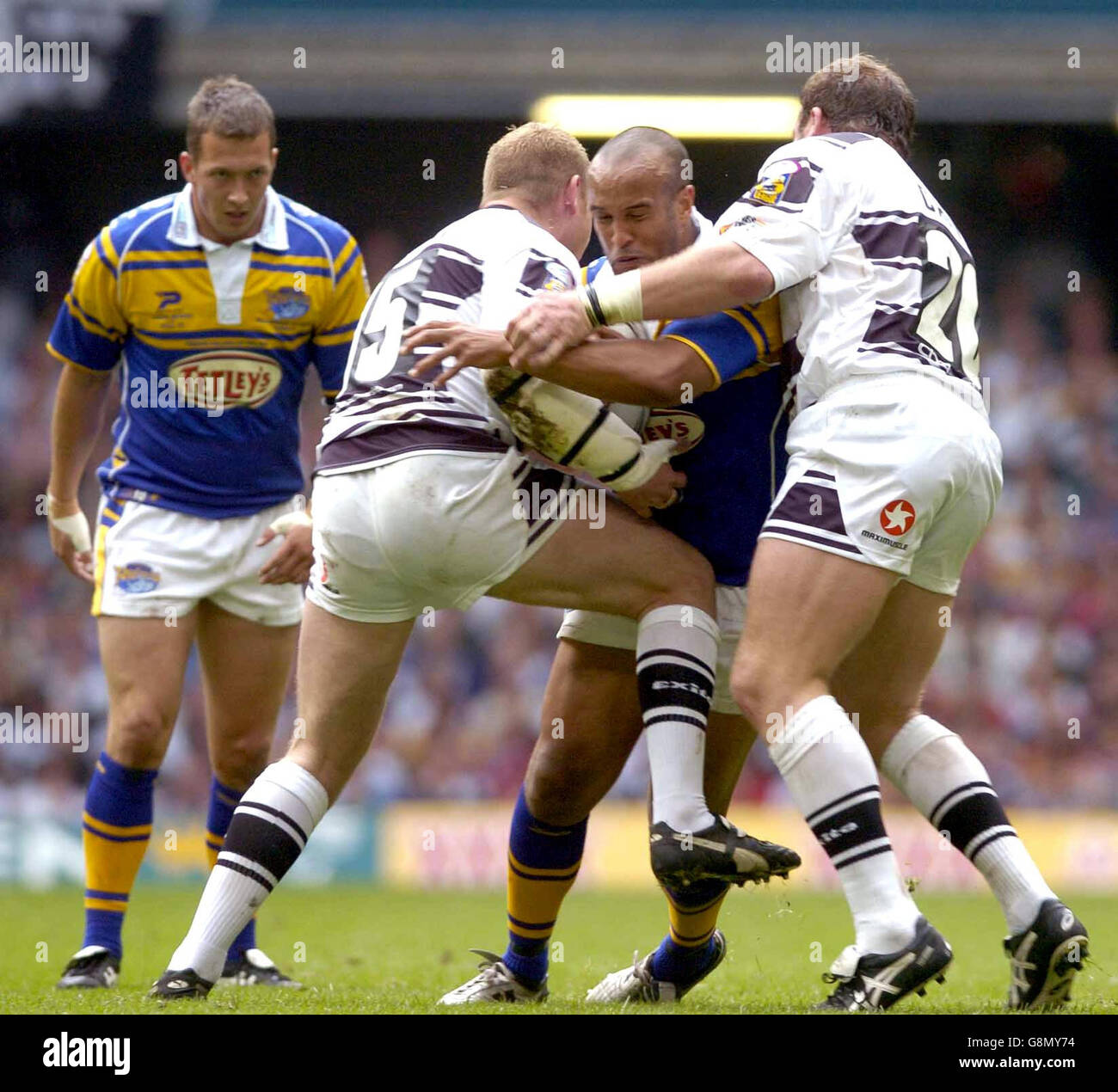 Leeds Rhinos' Matt Diskin (second right) is stopped by Hull's Jamie ...
