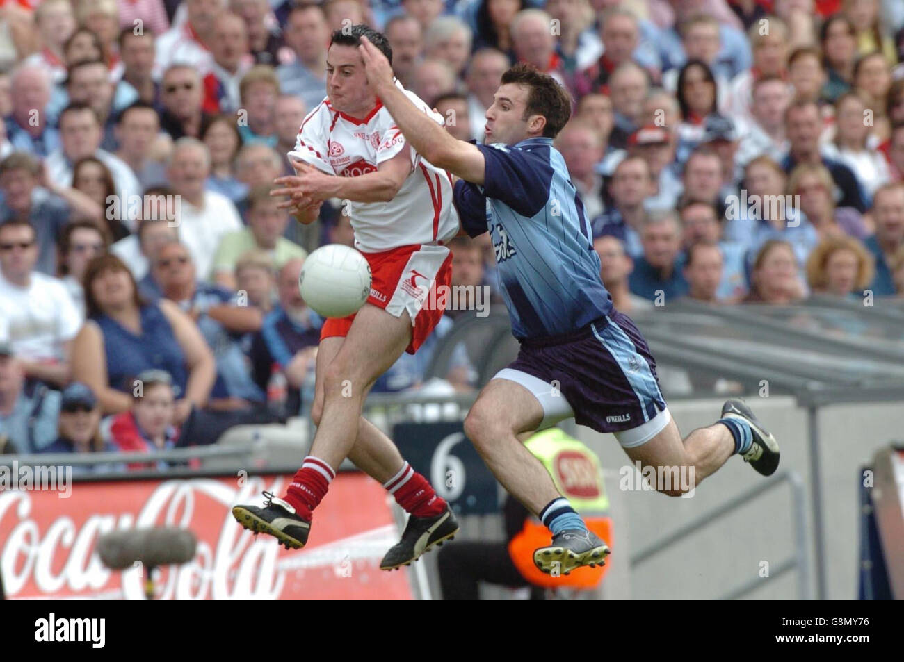 Tyrone's DavyHarte (left) and Dublin's Bryan Cullen leap for the ball ...