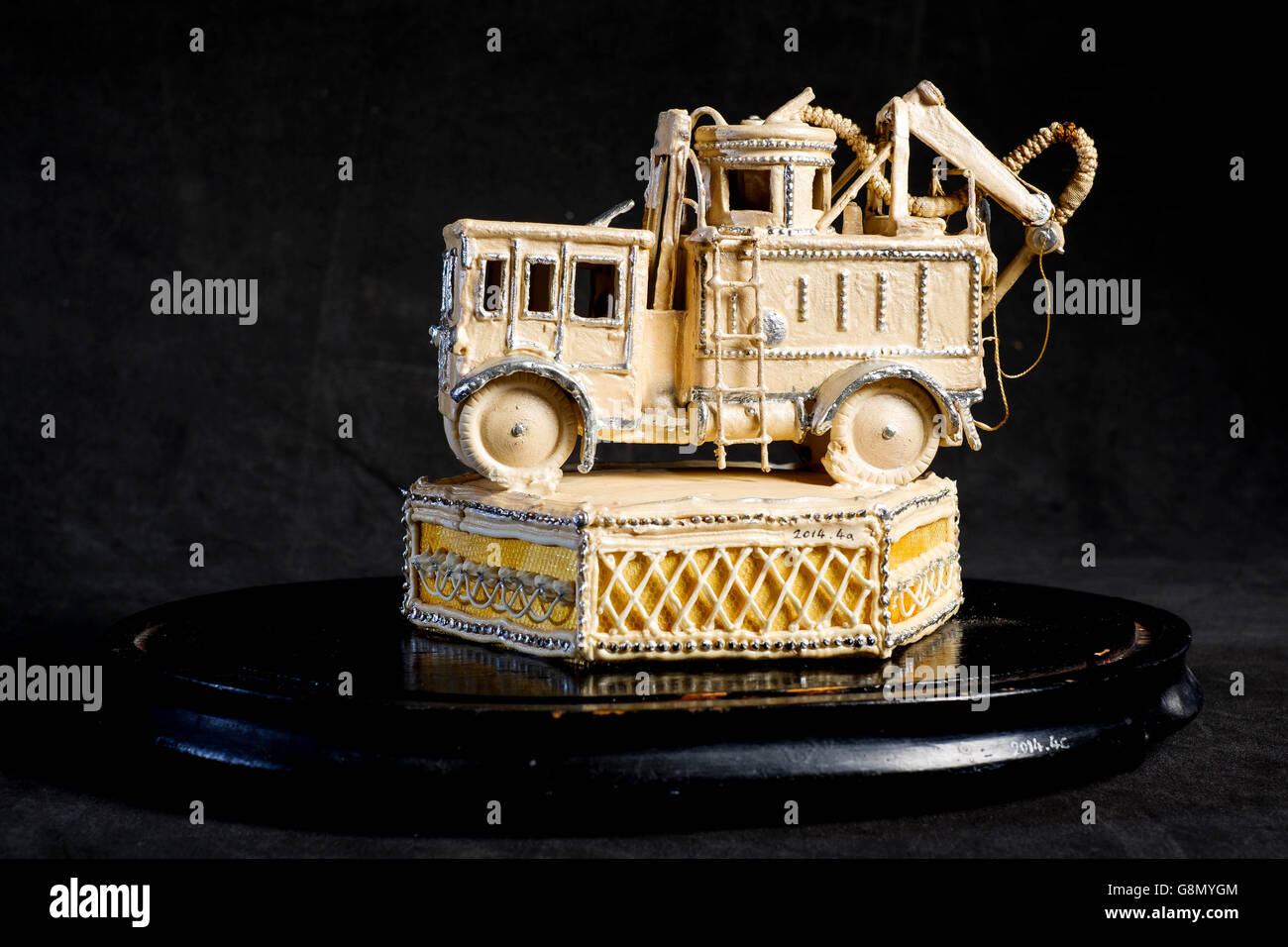 A wedding cake topper in the shape of a liquid waste disposal truck ...