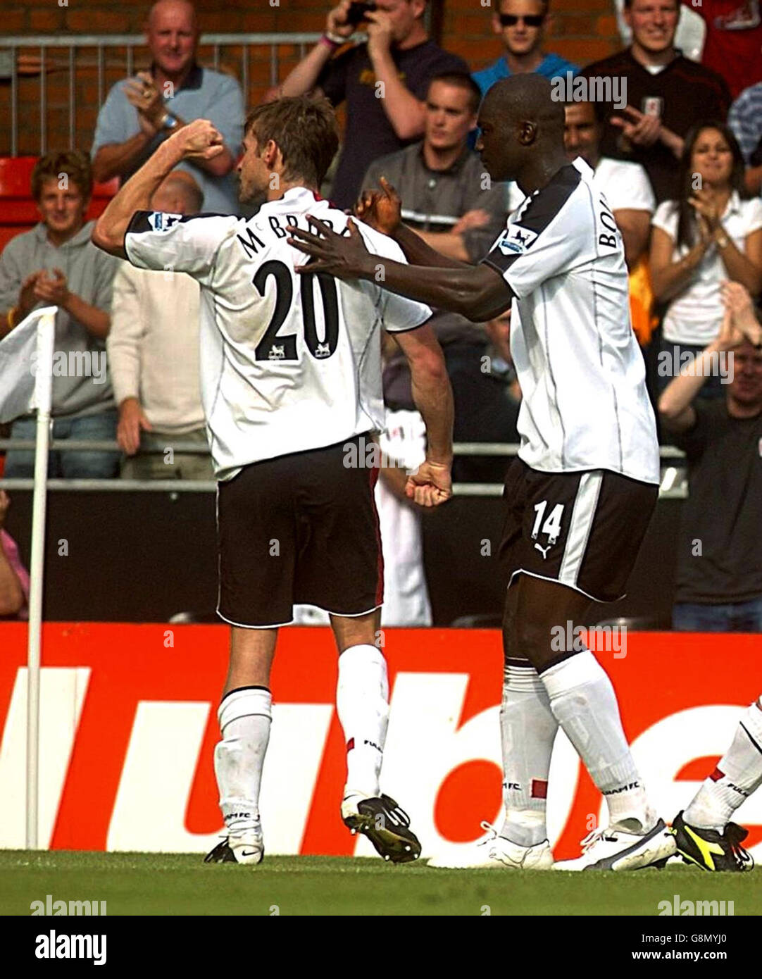 Fulham's Brian McBride (L) celebrates with team-mate Papa Bouba Diop ...