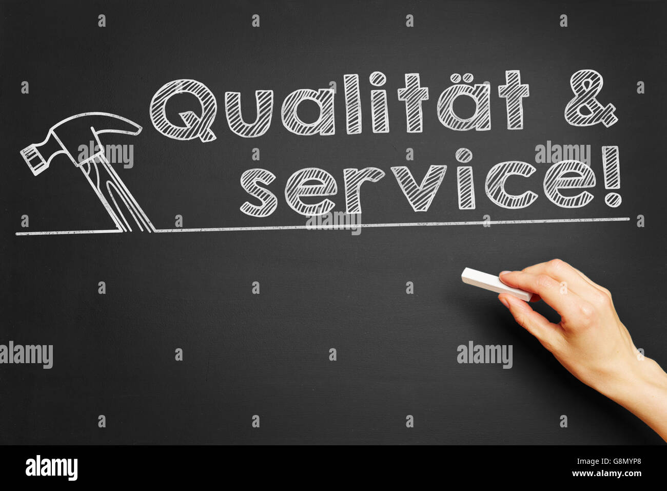 Hand writes in German "Qualität & Service!" (Quality & servcie) on ...