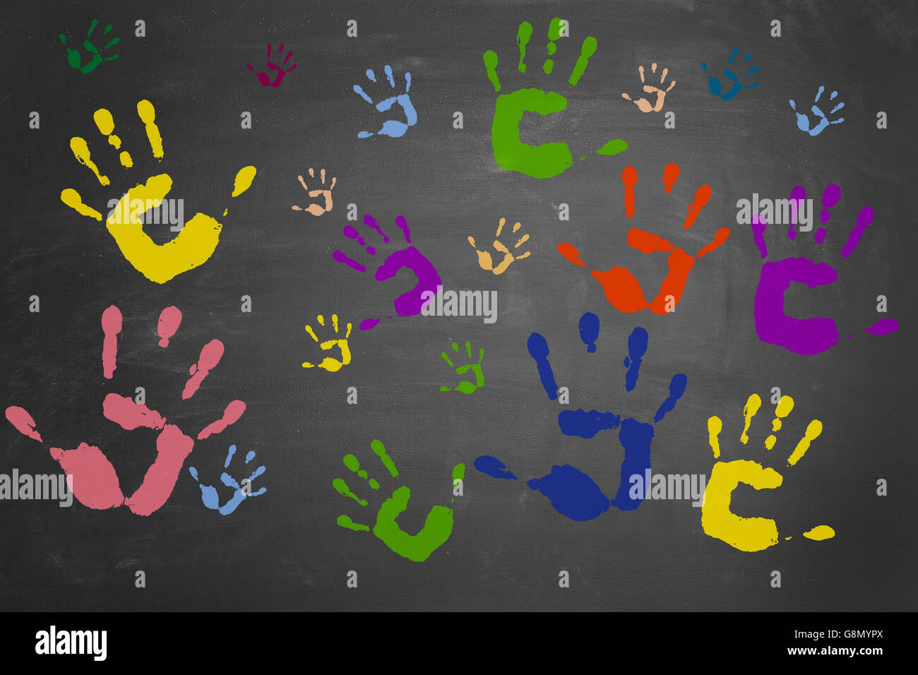 Many different colorful hand prints on a blackboard Stock Photo - Alamy