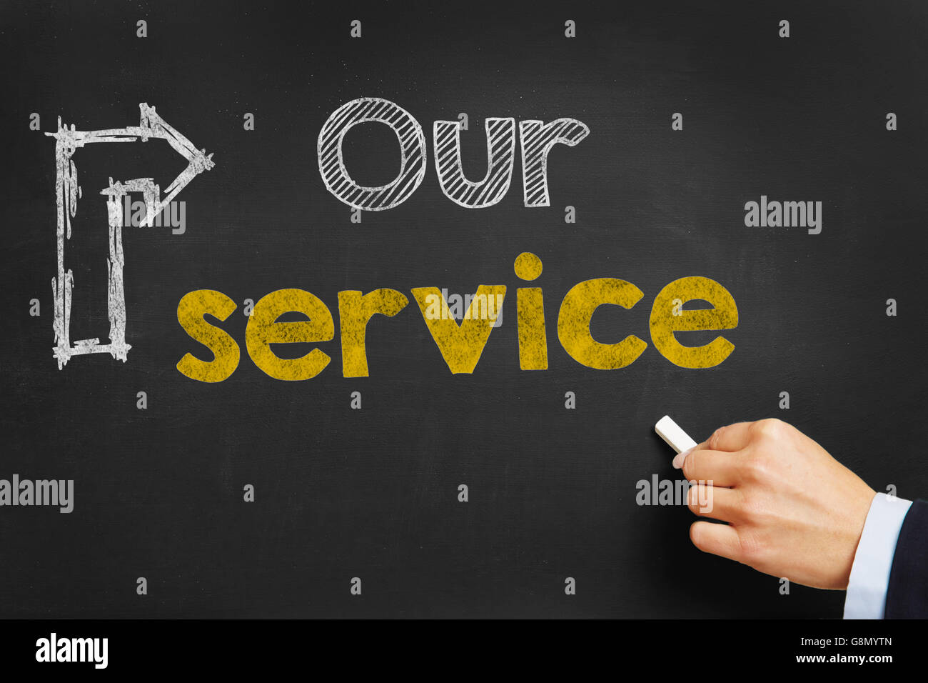 Hand writes "Our Service" on blackboard Stock Photo - Alamy