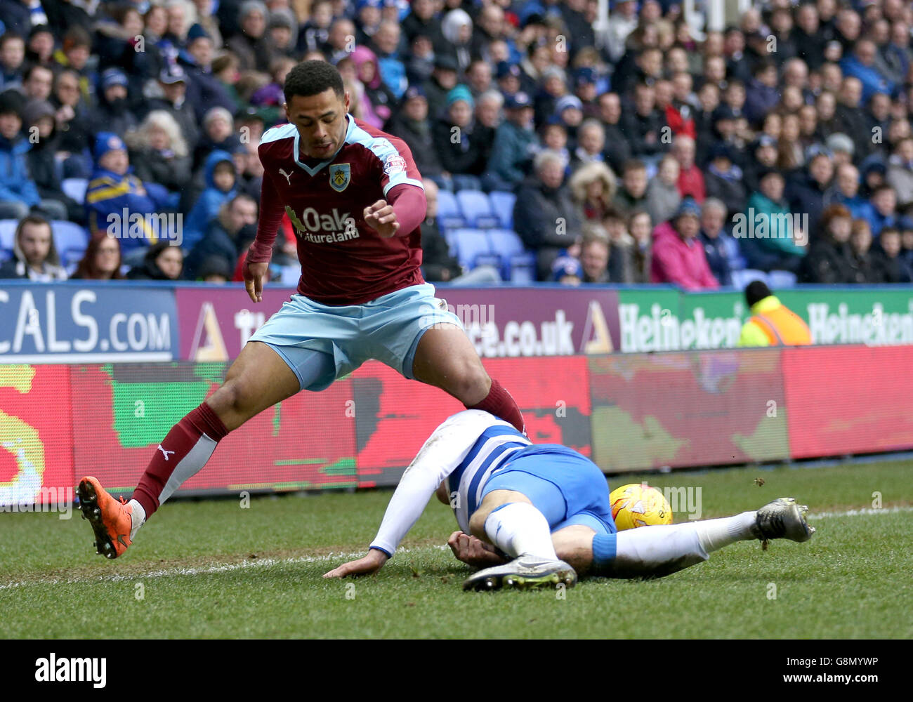 Burnley's Andre Gray and Reading's Jake Cooper (on floor) battle for ...