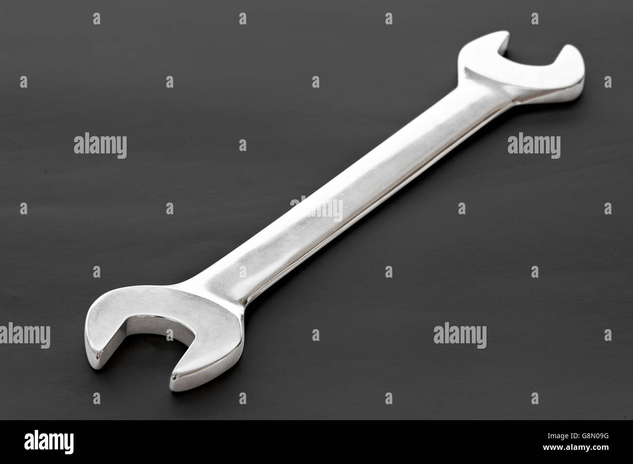 Metal Hand Spanner On Black Stock Photo - Alamy