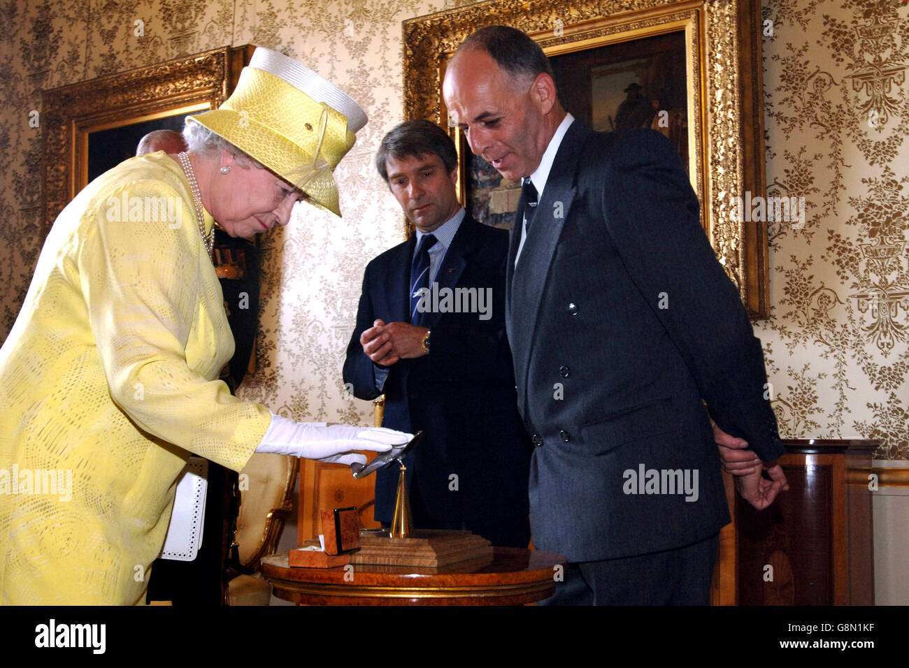 Queen Elizabeth II and the Duke of Edinburgh are presented by Chris ...