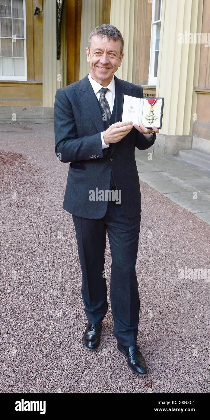 Screenwriter Peter Morgan holds his Commander of the British Empire ...