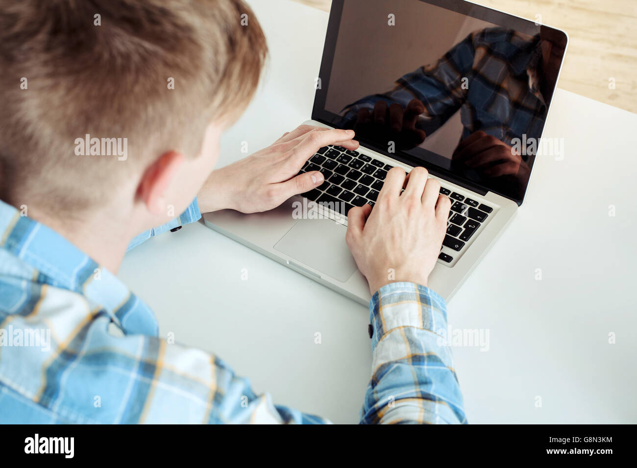 Modern problem: youth and computers. Young student using laptop. Nice ...