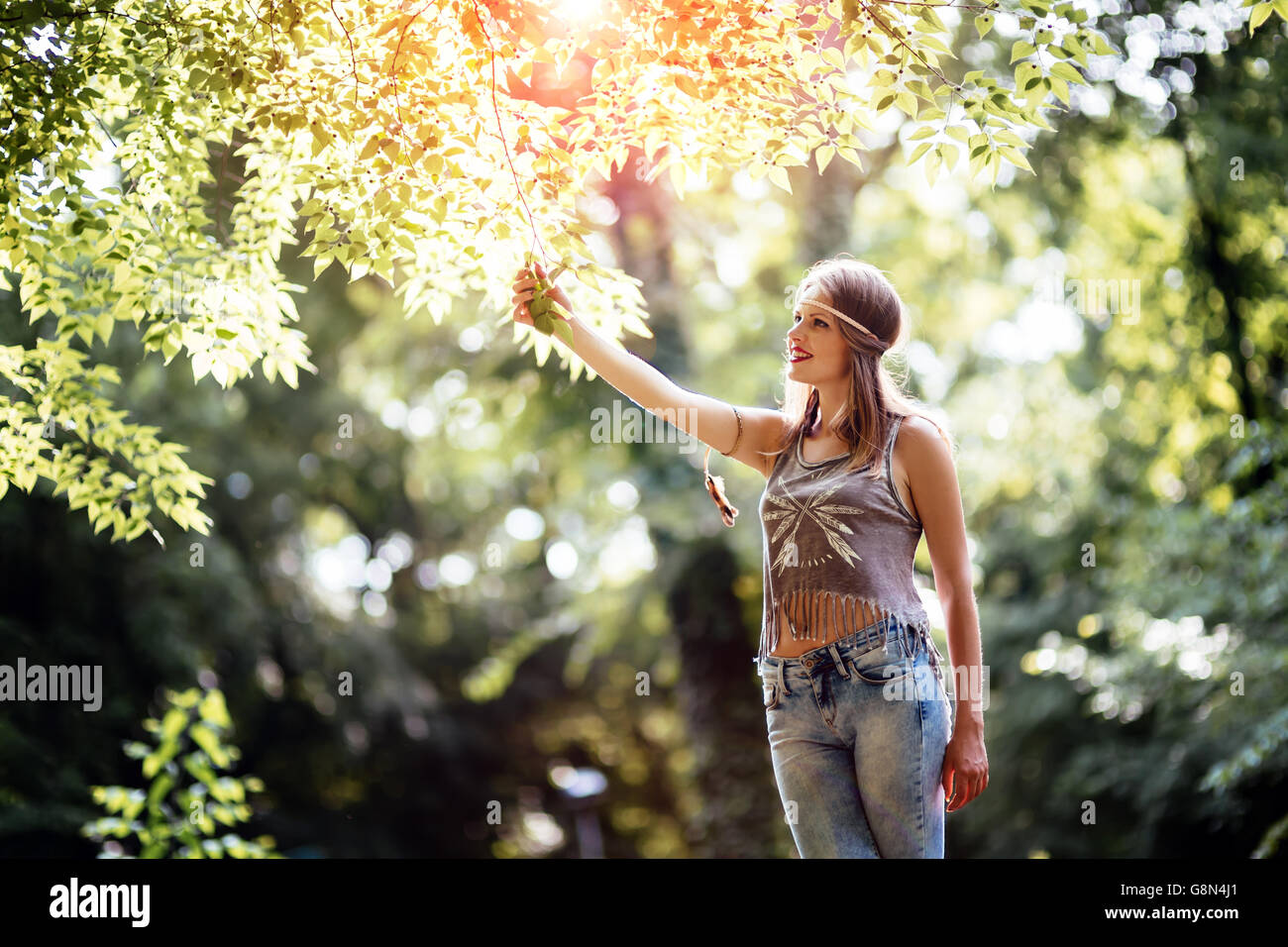 Beautiful smiling blonde hippie in nature Stock Photo - Alamy