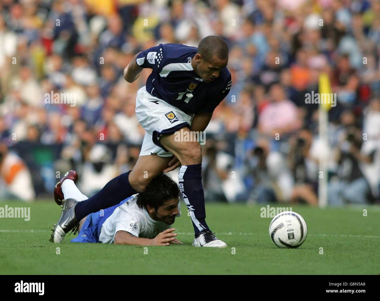 Italy's Gennaro Gattuso slides under the foot of Scotland's Nigel ...
