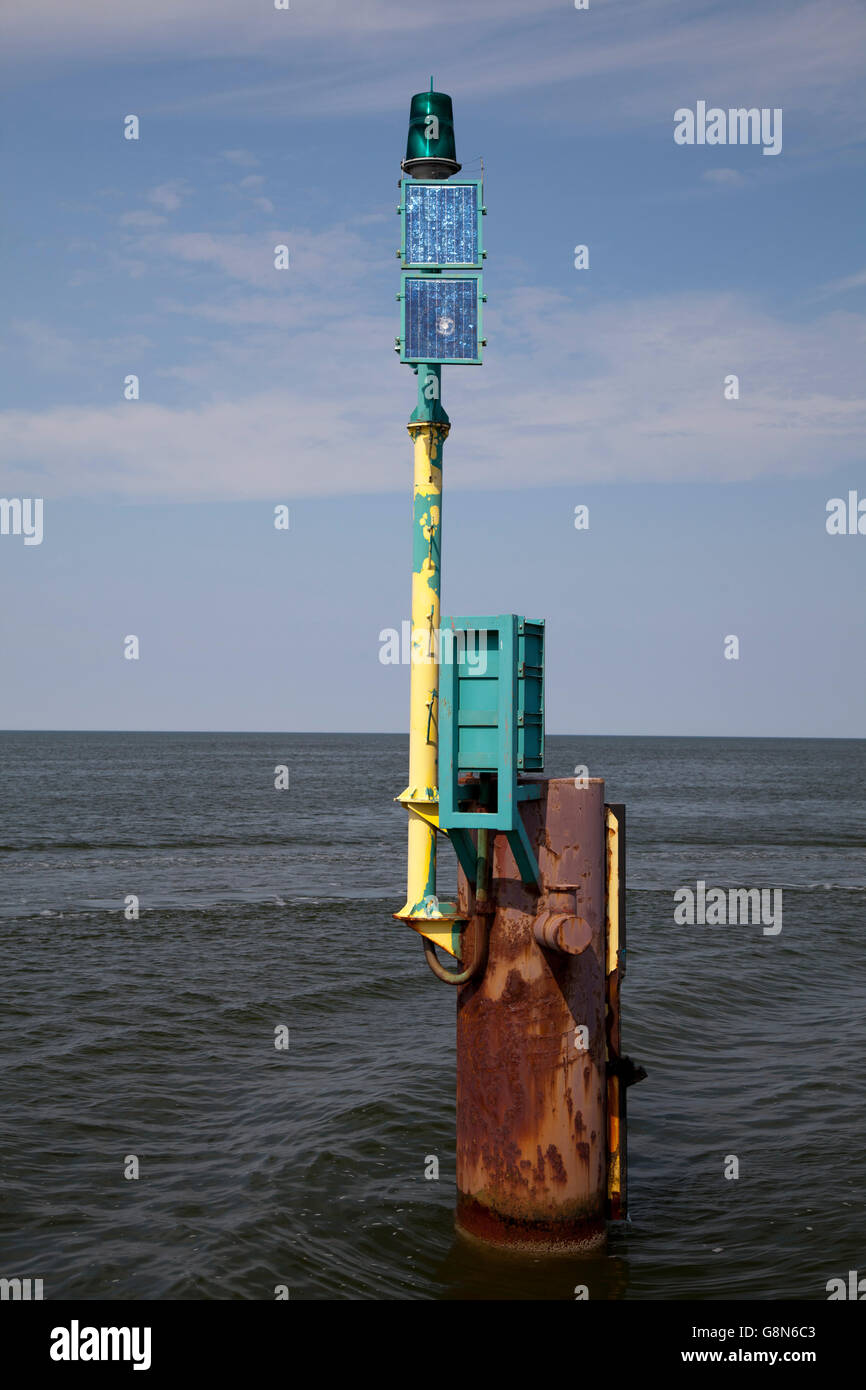 A green lamp and solar panels on a pole, navigation light, aids to ...