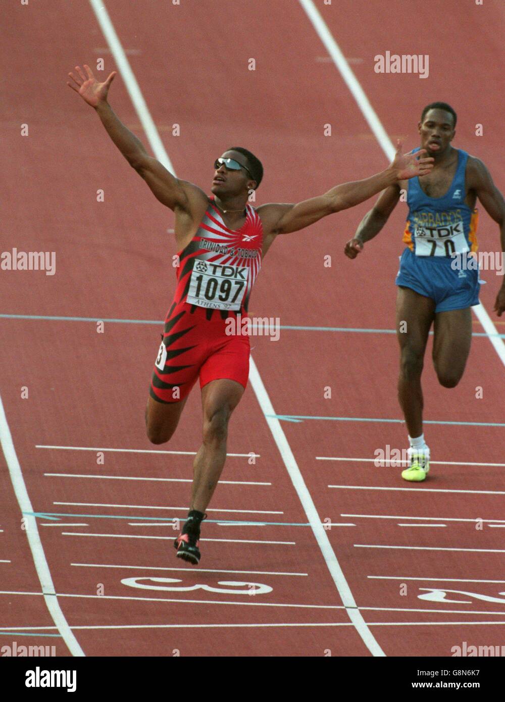 Ato Boldon wins the gold medal (left), leaving Obadele Thompson of ...