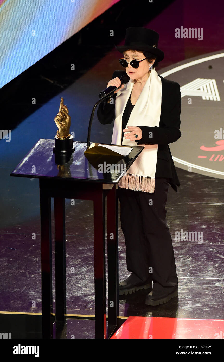 Yoko Ono collects the NME Inspiration Award on stage during the NME ...