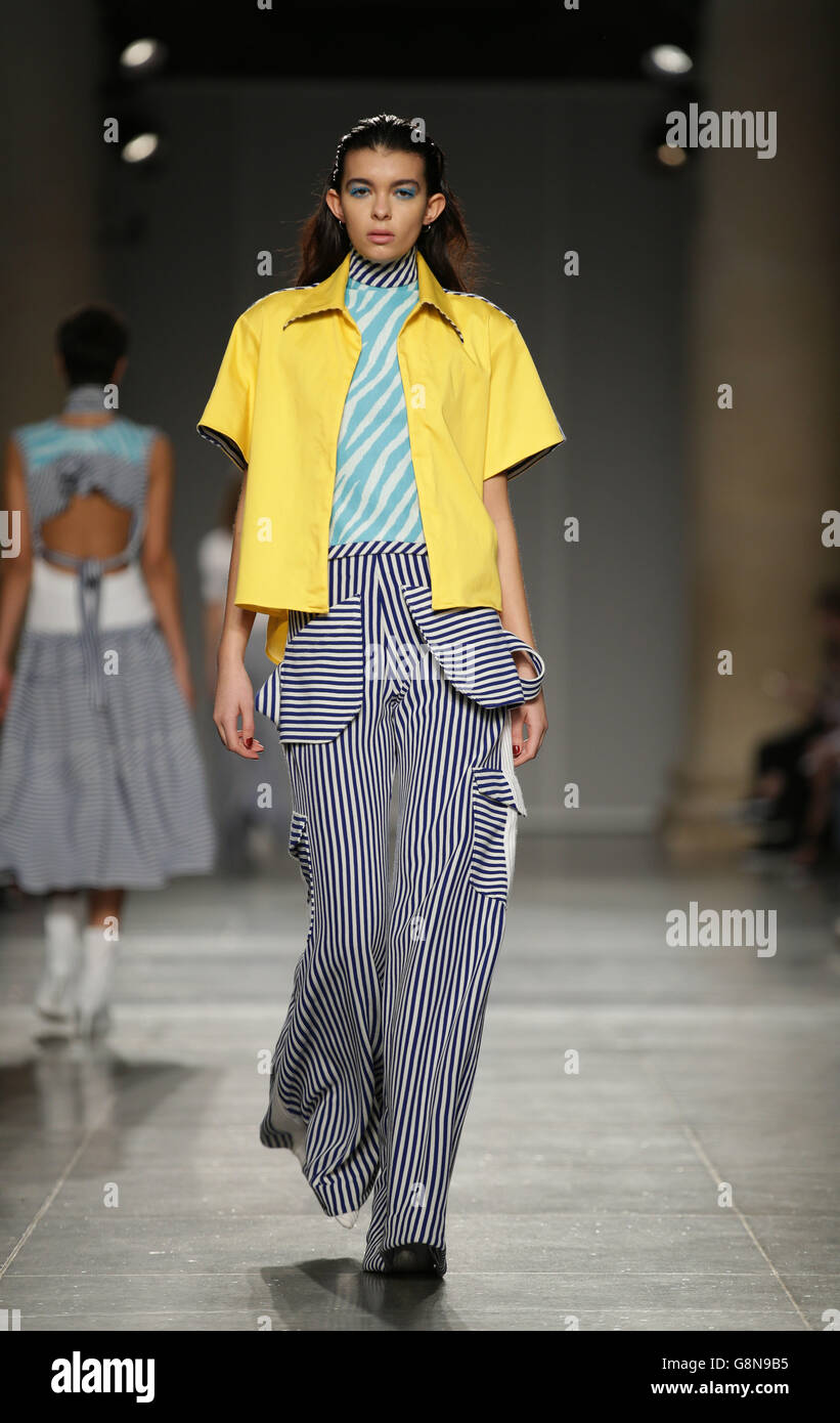 A model wearing a design by Richard Malone on the catwalk during the ...