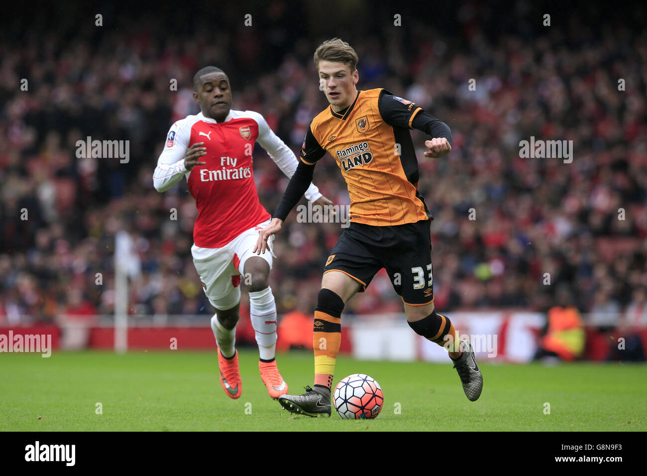 Hull City's Josh Tymon and Arsenal's Joel Campbell (left) in action ...