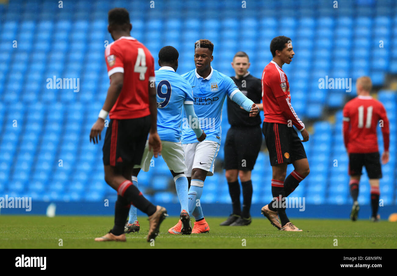 Manchester City's Ashley Smith-Brown (facing) celebrates with Isaac ...