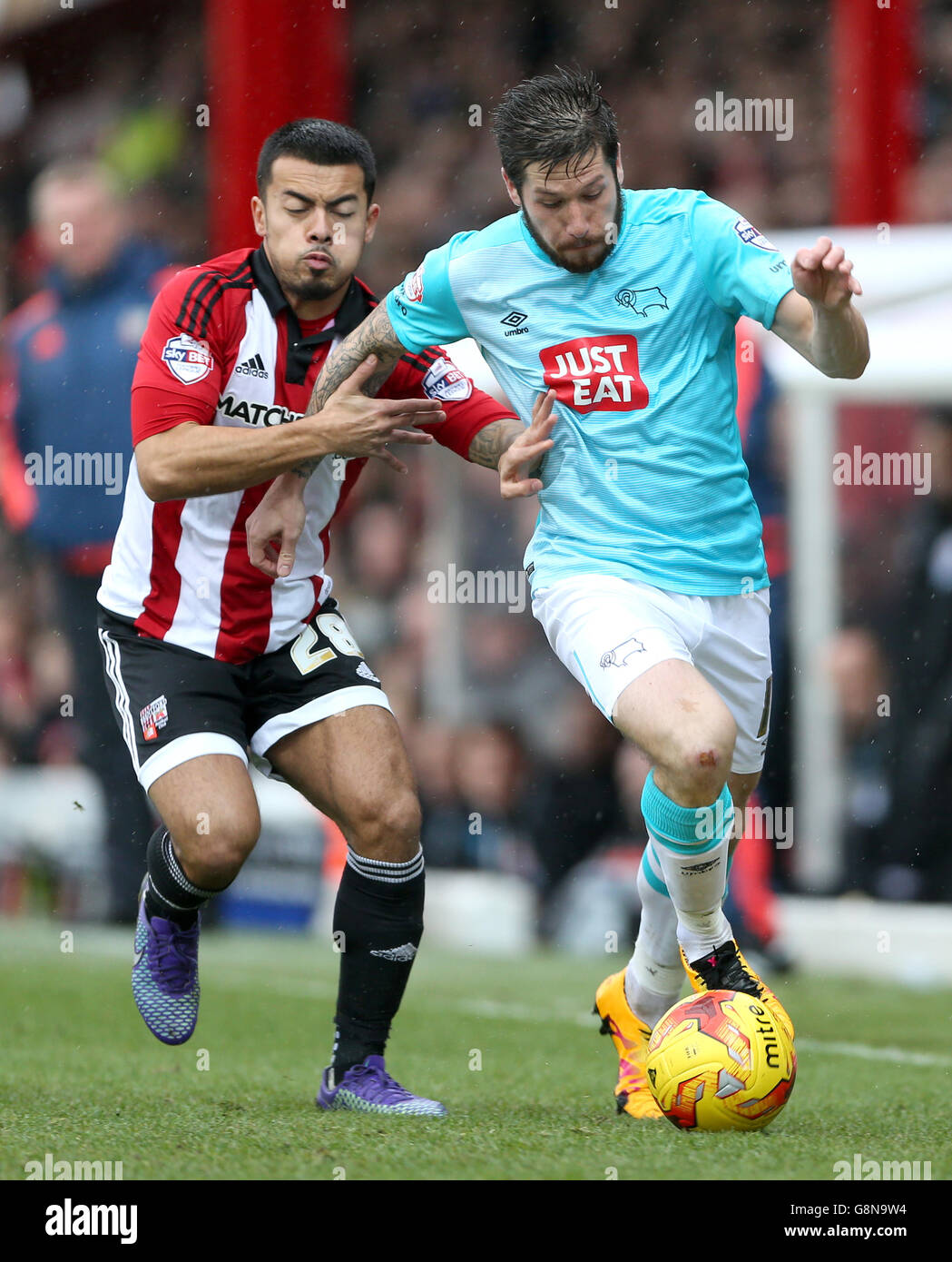 Brentford's Nico Yennaris (left) and Derby County's Jacob Butterfield ...