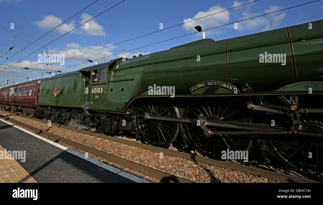 The Flying Scotsman, painted in its traditional colours, passes through ...