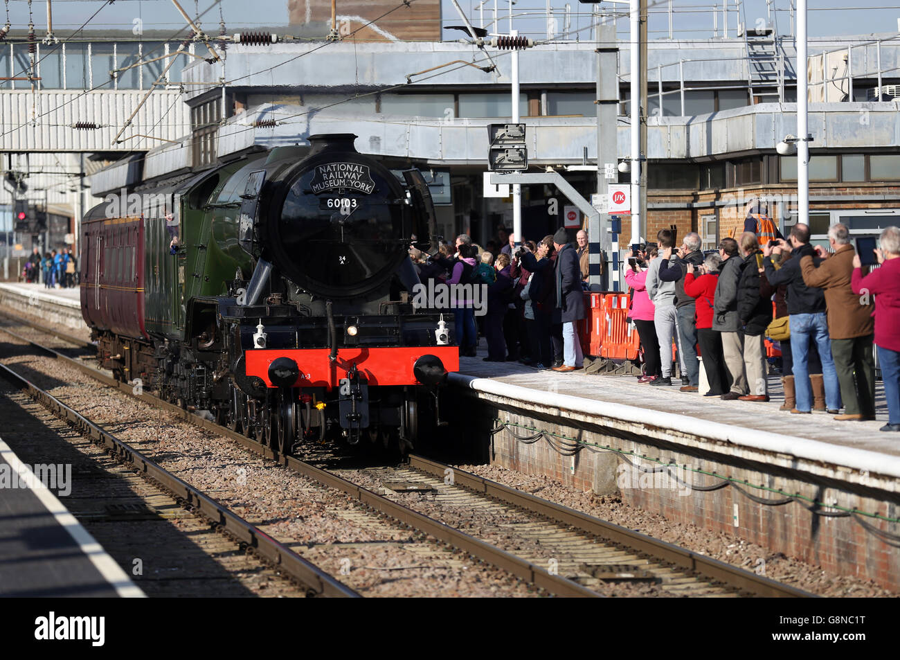 The Flying Scotsman, painted in its traditional colours, passes through ...