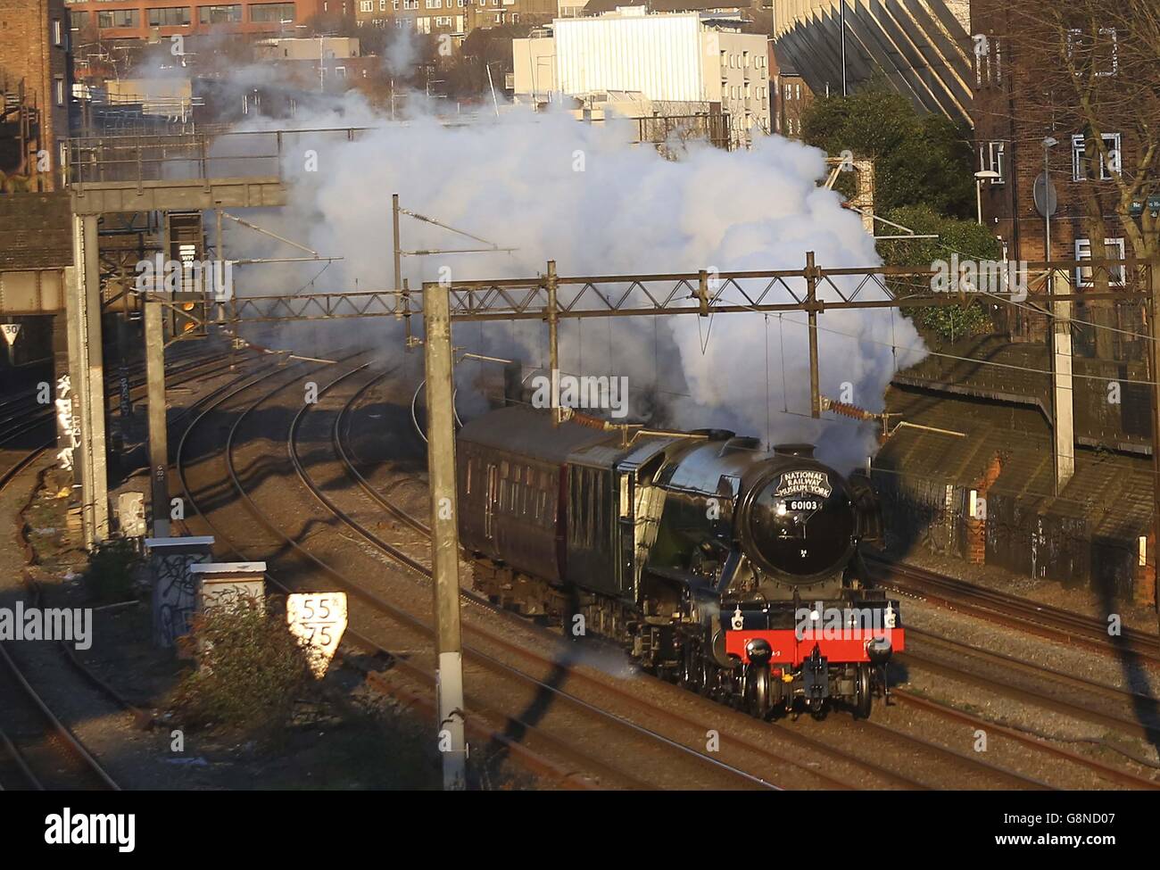 The Flying Scotsman, painted in its traditional colours, passes through ...