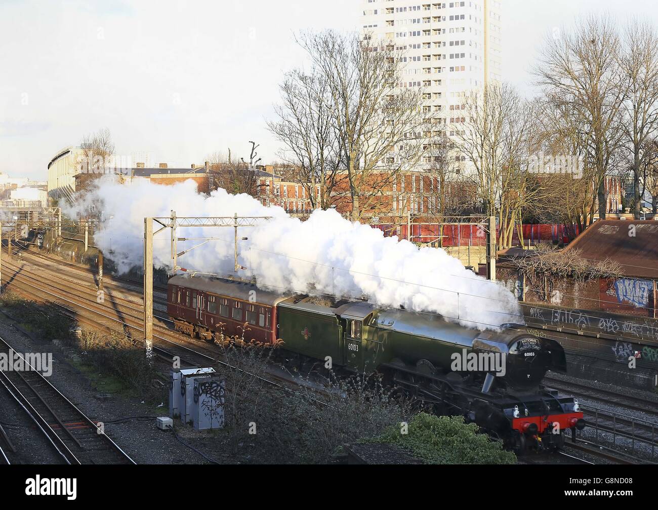 The Flying Scotsman, painted in its traditional colours, passes through ...