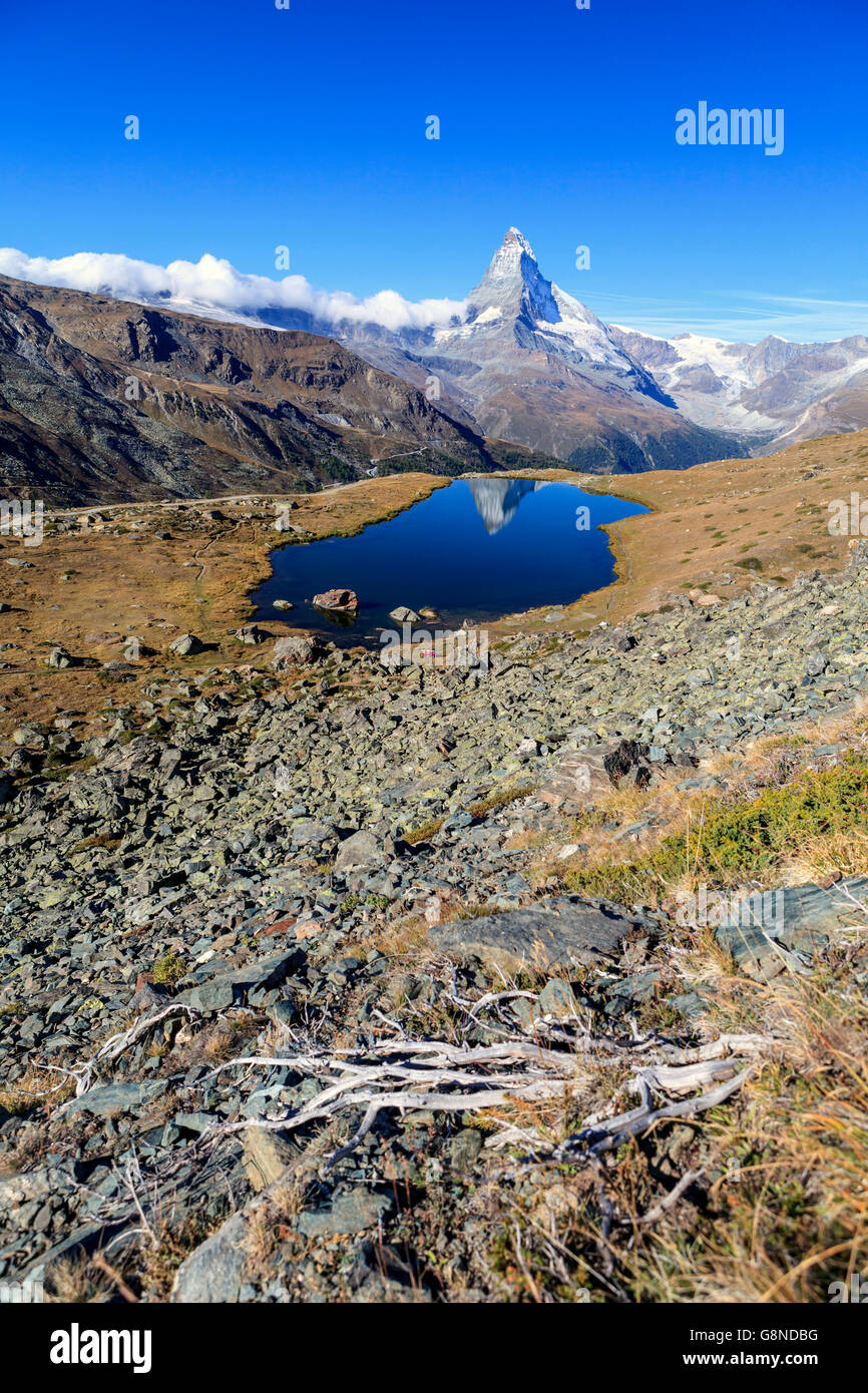 The tip of the Matterhorn is reflected in lake Stellisee Zermatt Canton ...